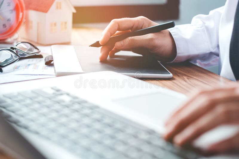 Graphic Designer Working and Writing on Graphic Tablet while Using ...