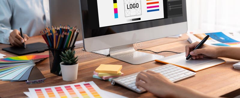 Graphic Designer Works on Computer Laptop with Digital Pen. Scrutinize ...