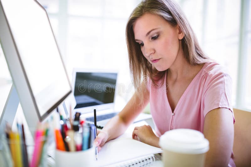 Graphic Designer Writing on Book Stock Image - Image of creative ...