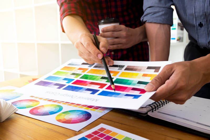 Graphic Designers Choose Colors from the Color Bands Samples for Design ...