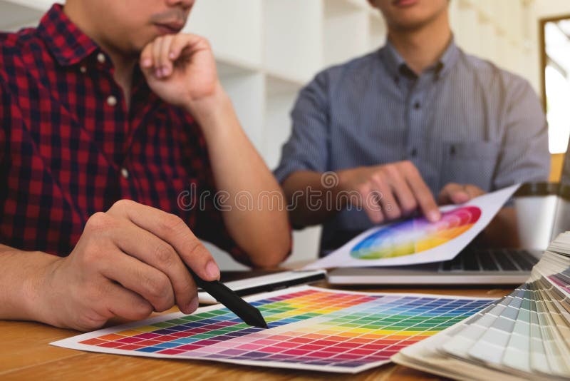 Graphic Designers Choose Colors from the Color Bands Samples for Design ...