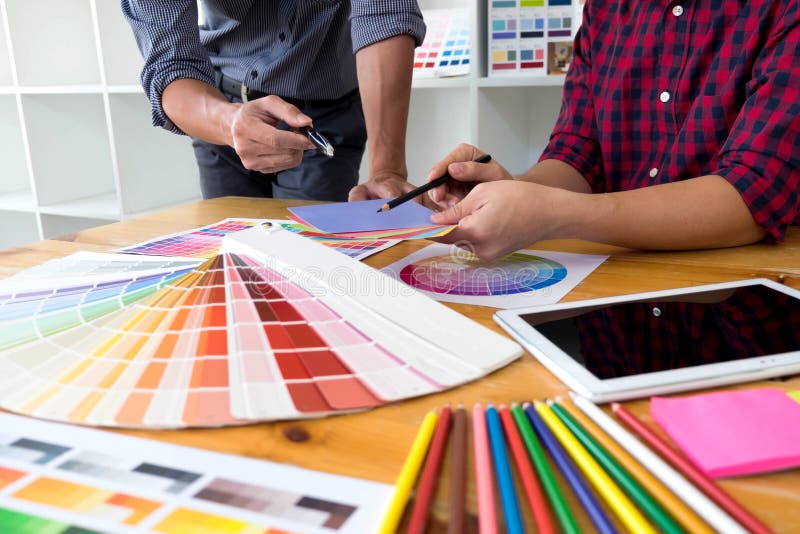 Graphic Designers Choose Colors from the Color Bands Samples for Design ...