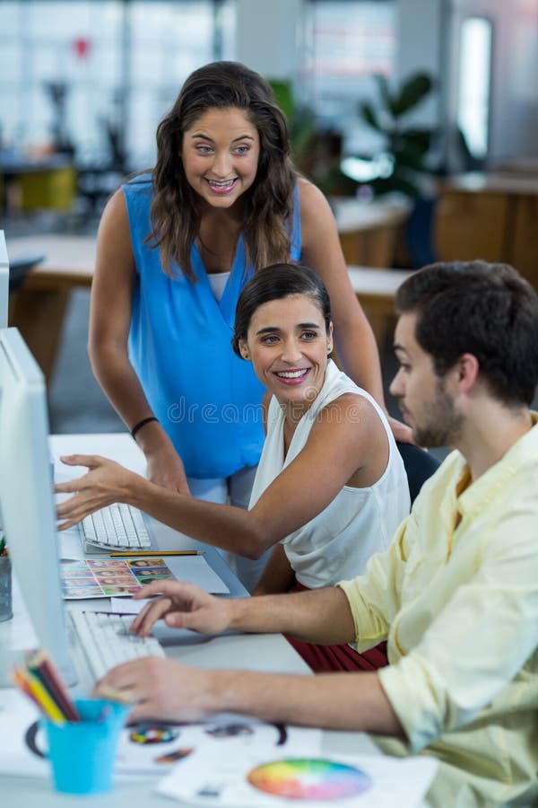 Graphic Designers Interacting while Working on Personal Computer Stock ...