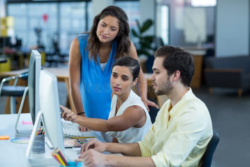 Graphic Designers Interacting while Working on Personal Computer Stock ...