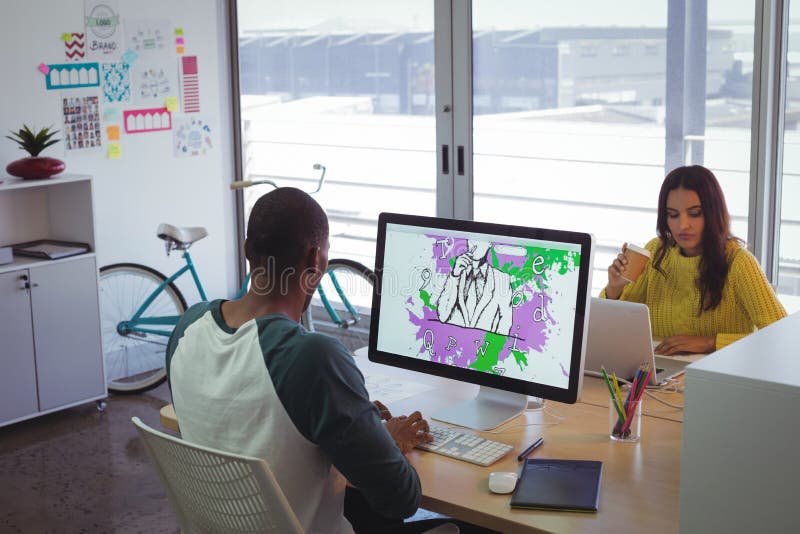 Graphic Designers Using Computer and Laptop in Creative Office Stock ...