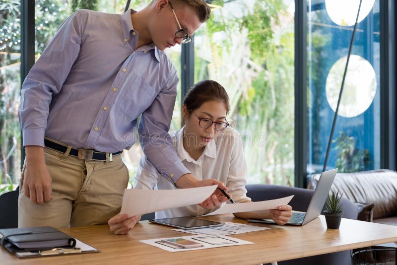 Graphic Designers Work Together with Computer Designing Application for ...