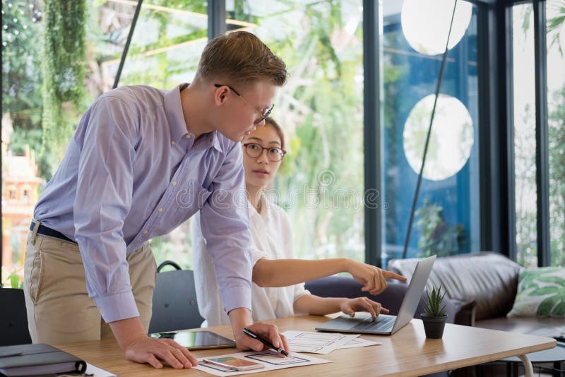 Graphic Designers Work Together with Computer Designing Application for ...