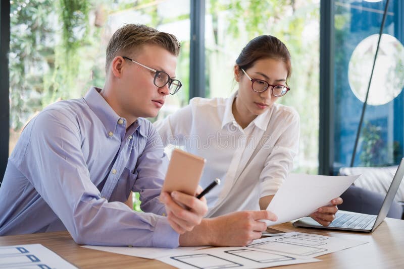 Graphic Designers Work Together with Computer Designing Application for ...