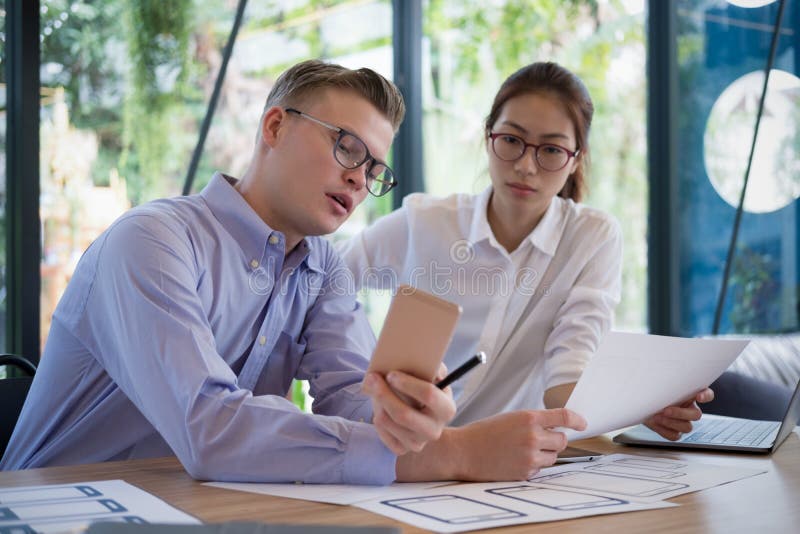 Graphic Designers Work Together with Computer Designing Application for ...