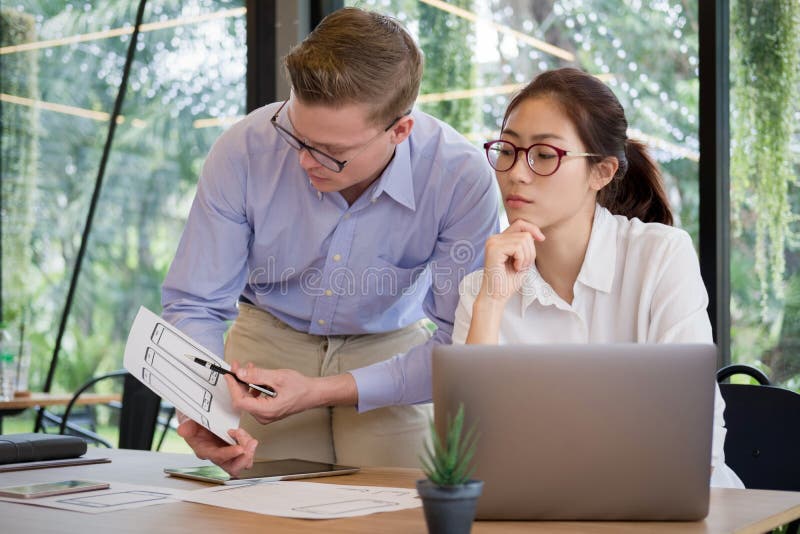 Graphic Designers Work Together with Computer Designing Application for ...