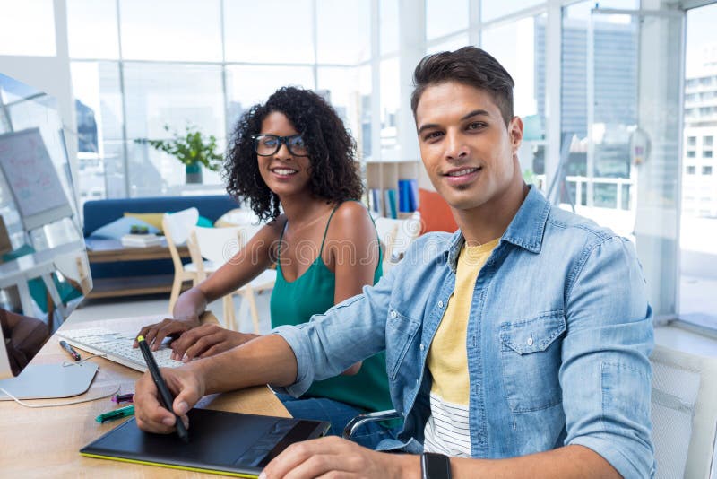 Graphic Designers Working on Computer at Desk Stock Photo - Image of ...