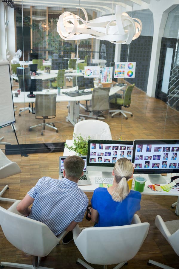 Graphic Designers Working at Their Desk Stock Image - Image of artist ...