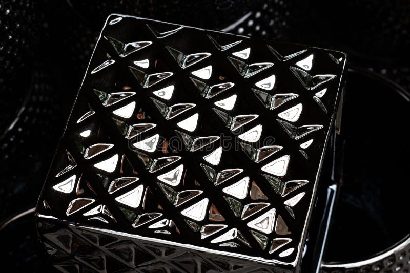 Graphic Elements are Reflected on a Metallic Cuboid. Stock Image ...