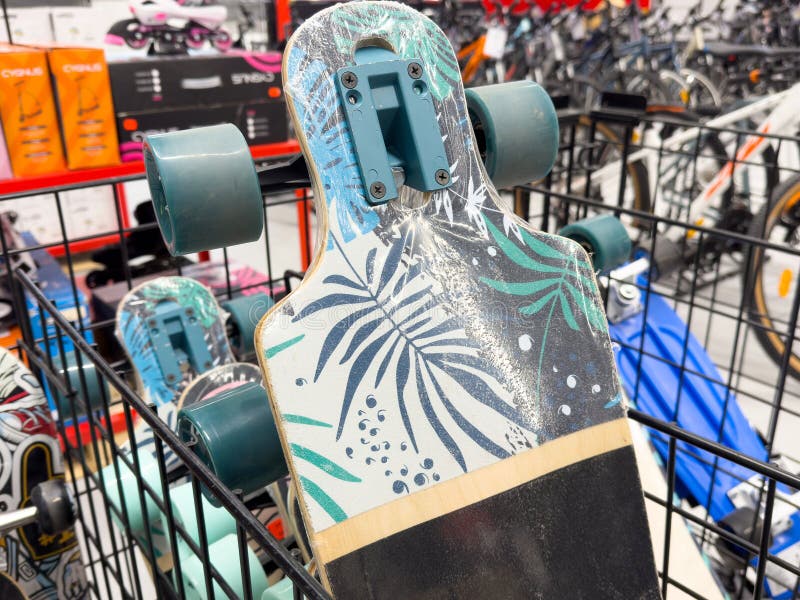 Graphic Longboard Decks in Store Display with Bicycles in Background ...