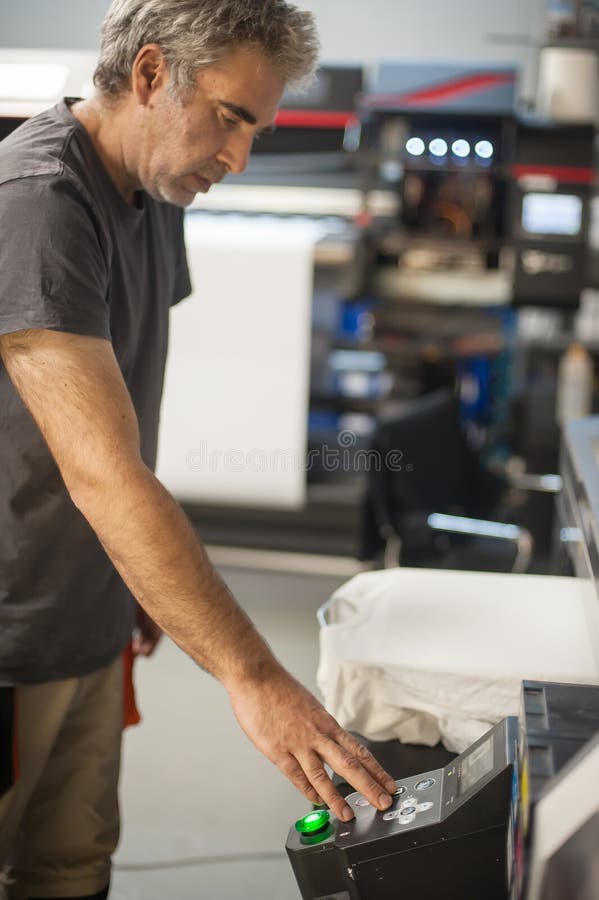 Graphic Print Technician Work on Digital T-shirt Printing Machine ...