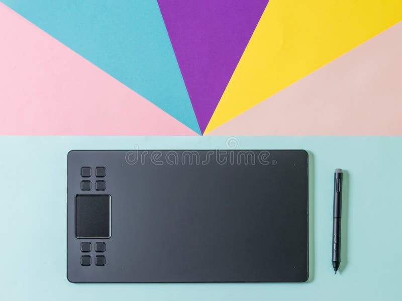 Graphic Tablet with a Pencil on a Background of Colored Paper. Stock ...