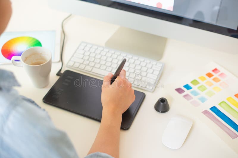 Graphic Web Designer Does the Work Using a Graphics Tablet, Desktop ...