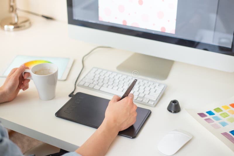 Graphic Web Designer Does the Work Using a Graphics Tablet, Desktop ...