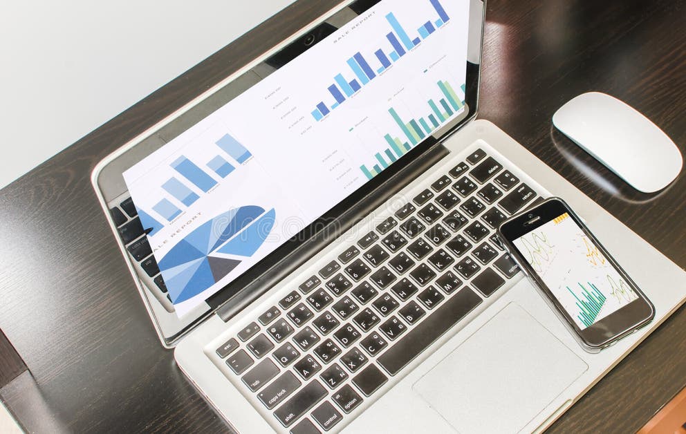 Graphs and laptop stock photo. Image of hands, information - 58991276