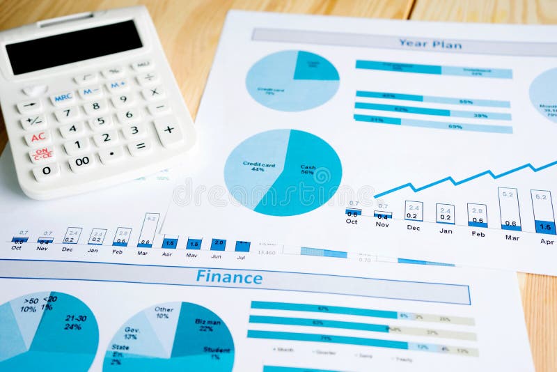 Graphs on White Paper with Calculator Stock Photo - Image of graphs ...