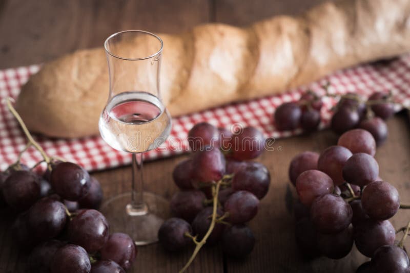 Grappa with Grape and Bread Stock Photo - Image of restaurant, grappa ...