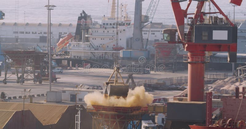 A Crane Loading Scrap in Cargo Ship Vessel at Recycling Metal Plant ...