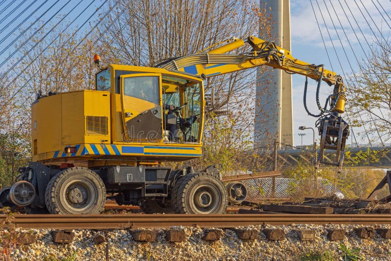 Grappling Forks Digger Railway Stock Image - Image of machinery, rails ...