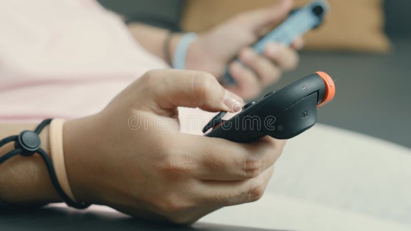 Grasping Wireless Controller, Gamer Relaxing on Sofa, Deeply Engaged in ...