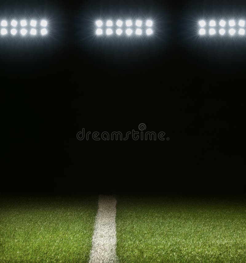 Grass Athletic Field with White Stripe and Dark Background Below ...