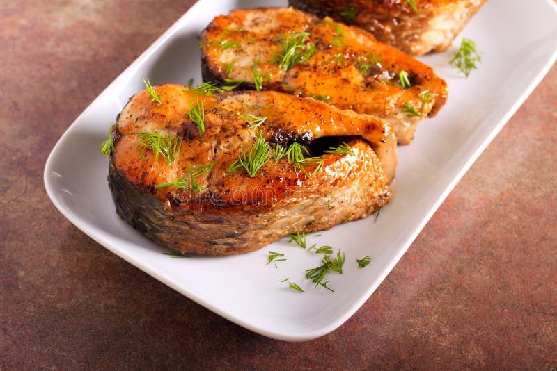 Grass carp steaks stock photo. Image of dinner, steak - 209767984