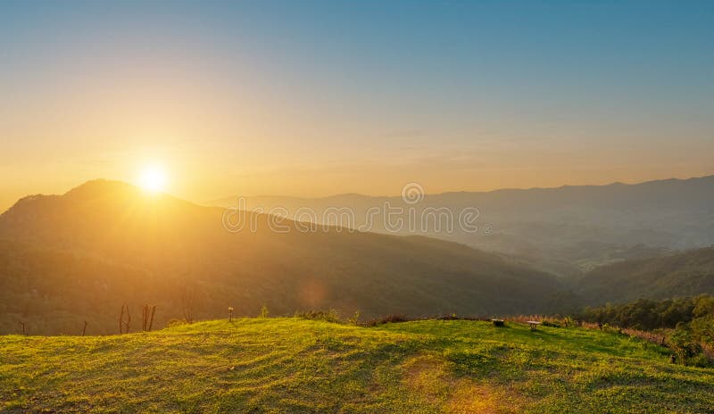 Grass Field and Mountains View with Sunset Sky Background. Countryside ...