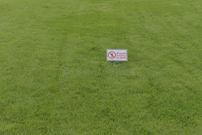 The Grass on the Field and Warning Signs Prohibiting Walking Int Stock ...
