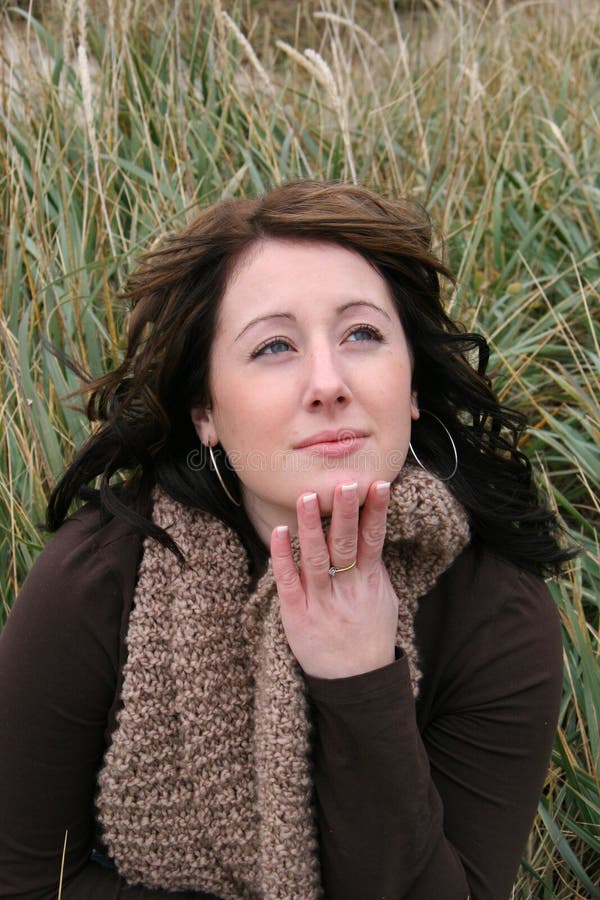 In Grass with Hand to Face stock photo. Image of nice, gorgeous - 339496