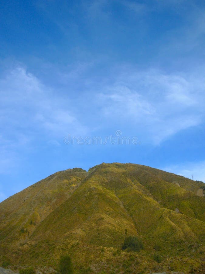 Grass Hill Under Deep Blue Sky Stock Photo - Image of range, hill ...