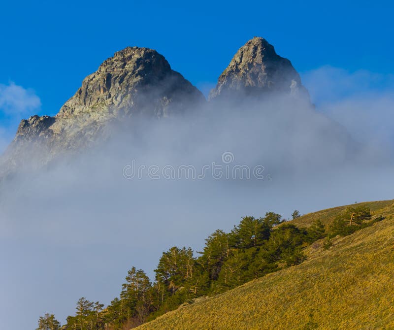 Grass Mountain Valley in Dense Mist and Clouds Stock Image - Image of ...