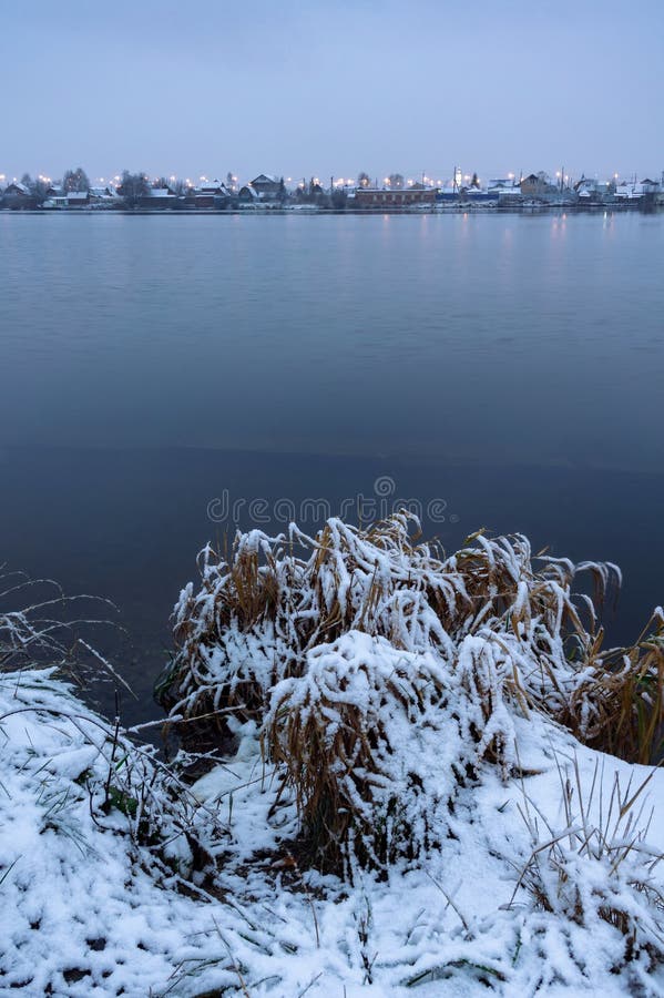 Grass with a Song of Snow Against the Background of the Lake Stock ...