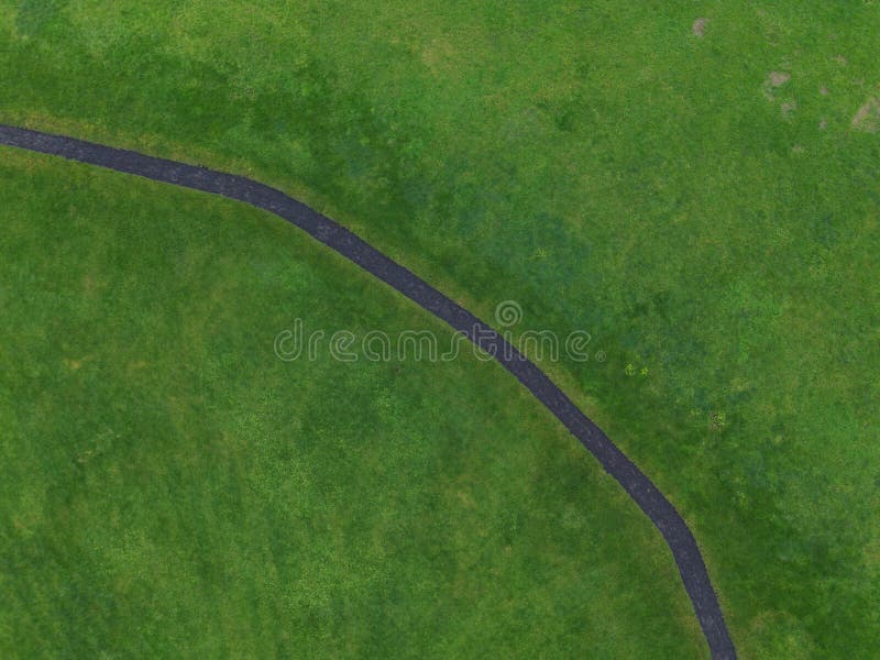 A Grassy Field with a Path Running through it from Aerial View Stock ...