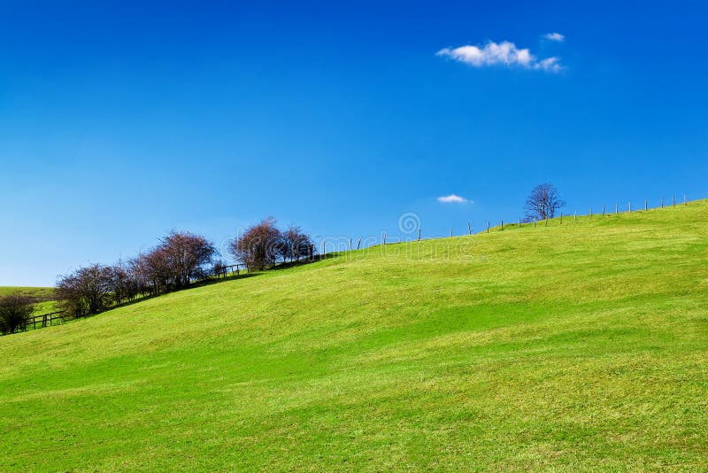 Grassy Green Hill with a Beautiful Clear Sky Stock Image - Image of ...