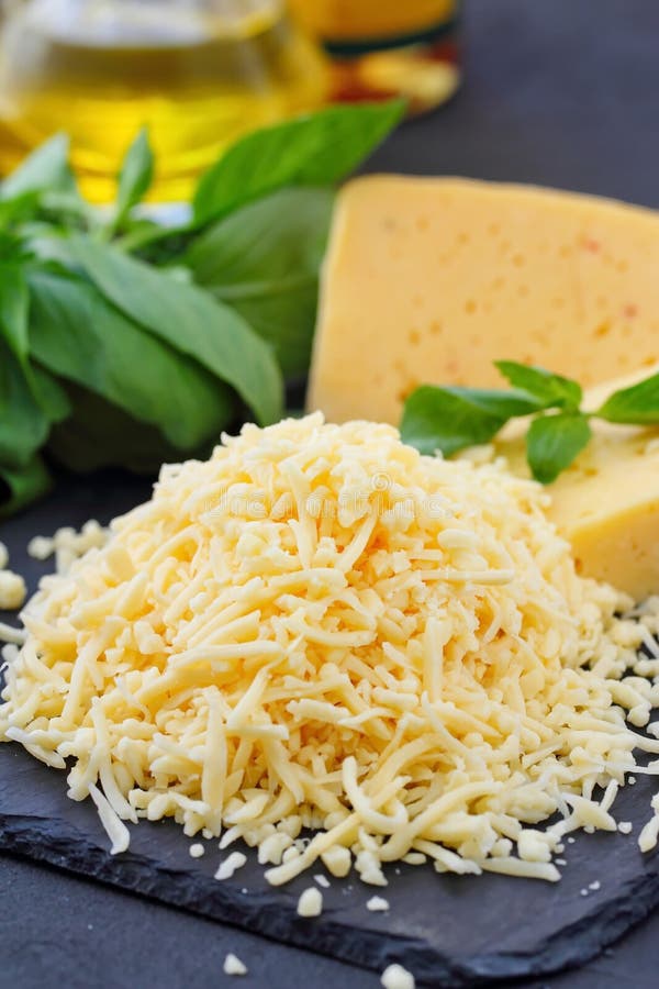 Grated cheese in a bowl stock image. Image of slice, orange - 65448931