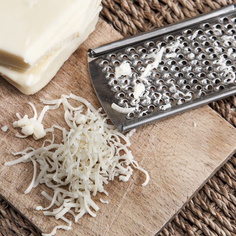 Grated cheese and grater stock photo. Image of equipment - 27087398