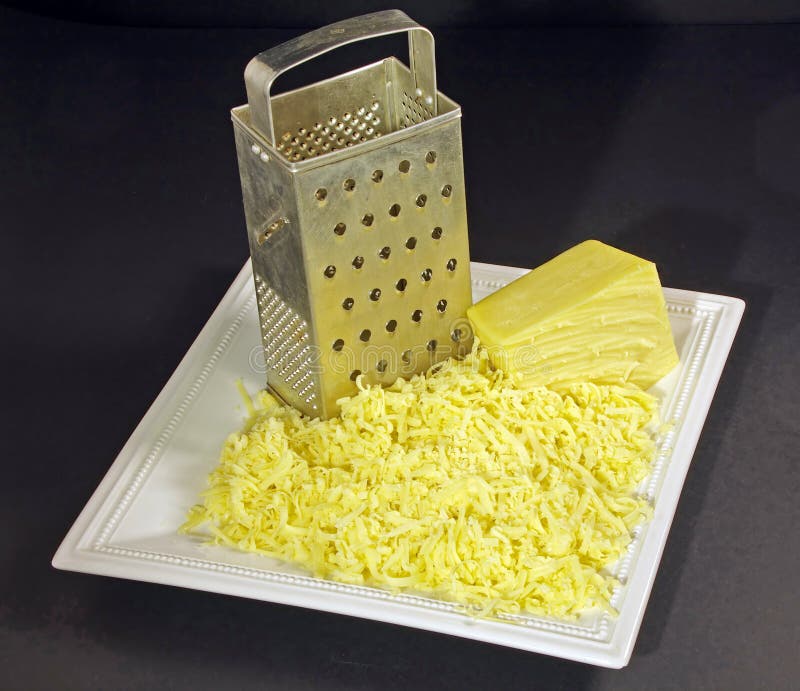 Grated Cheese Making with Electric Grater Machine Stock Photo - Image ...