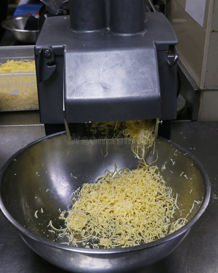 Grated Cheese Making with Electric Grater Machine Stock Image - Image ...