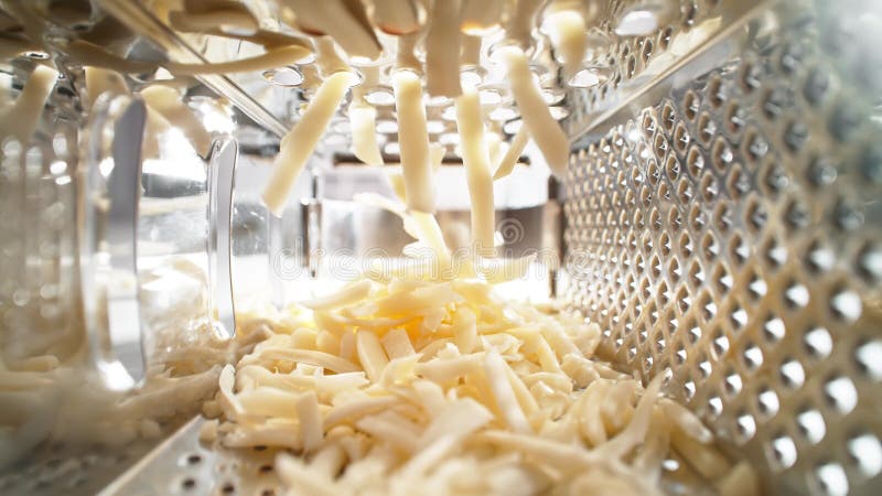 Grated Cheese Strips Falling into the Cheese Grater - View from Inside ...