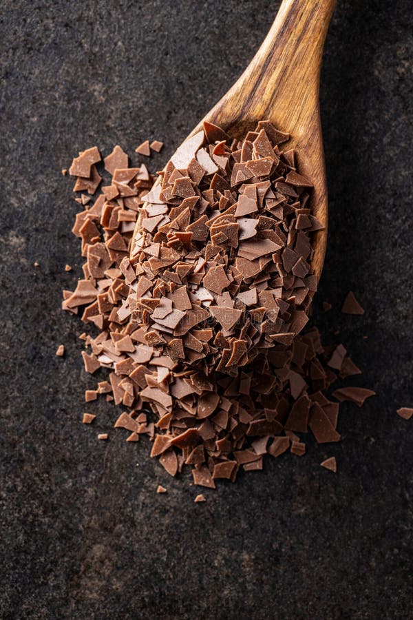 Grated Dark Chocolate. Chocolate Flakes in Wooden Spoon Stock Photo ...