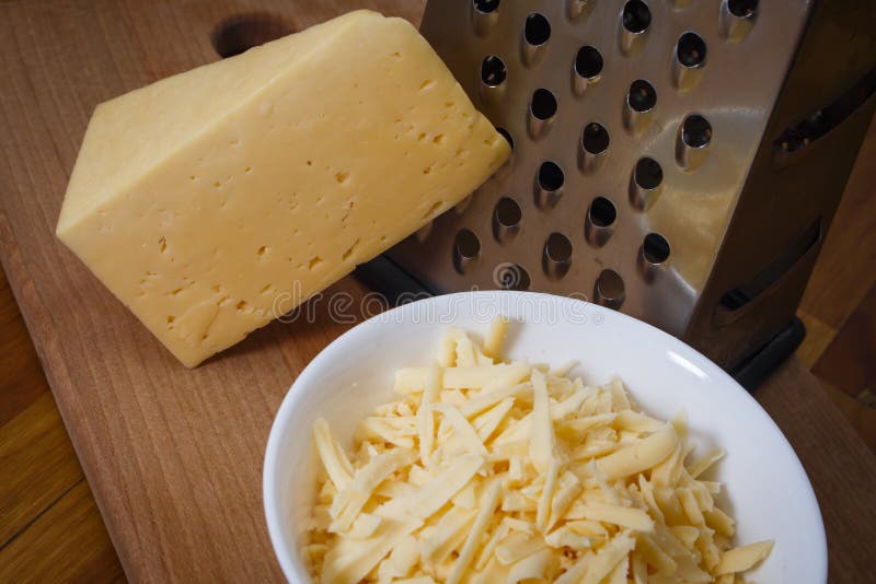 Grated Dutch Cheese in a Plate on a Board Stock Photo - Image of ...