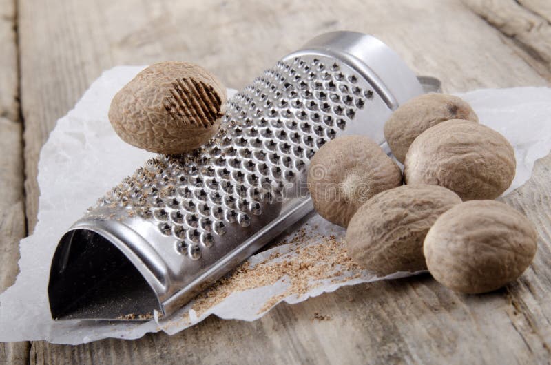 Grated Nutmeg and Powder on Paper Stock Photo - Image of muscat, spice ...