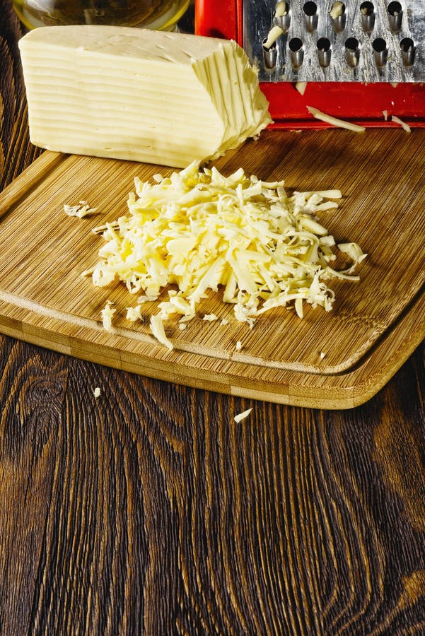 Grated Shredded Cheese on the Table Stock Image - Image of cheese ...