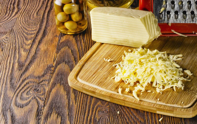 Grated Strips of Fresh Cheese on the Table Stock Photo - Image of food ...