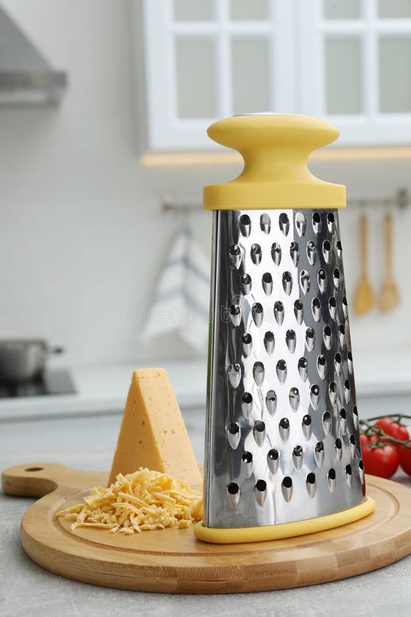 Grater and Cheese on Table in Kitchen Stock Image - Image of ...