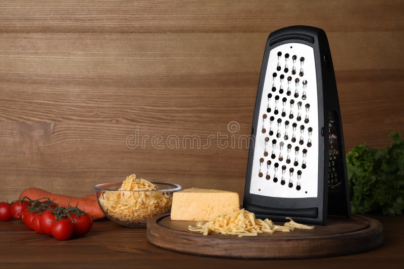 Grater, Cheese and Vegetables on Wooden Table. Space for Text Stock ...